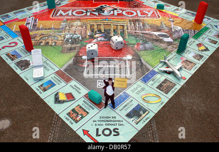 'Mister Monopoly' poses on an oversized version of the new 'German ...
