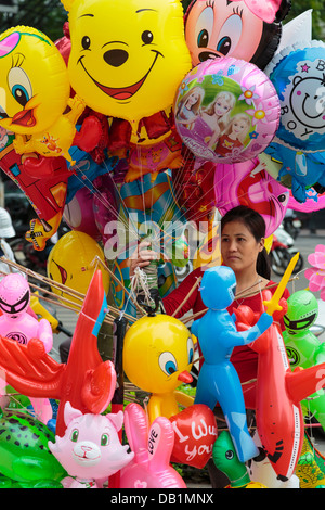 Selling party balloons on the street in Hanoi, Vietnam, Asia Stock ...