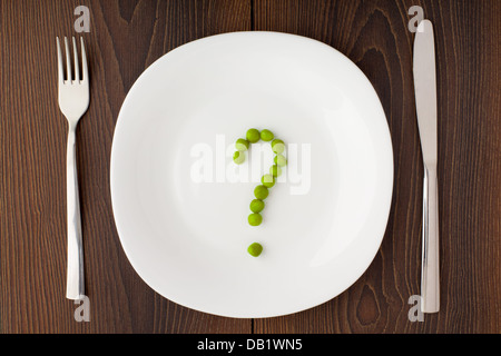 Question mark made of peas on plate Stock Photo - Alamy