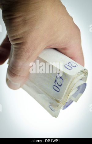 Hand Holding Rolled Up Twenty Pound Notes Stock Photo - Alamy