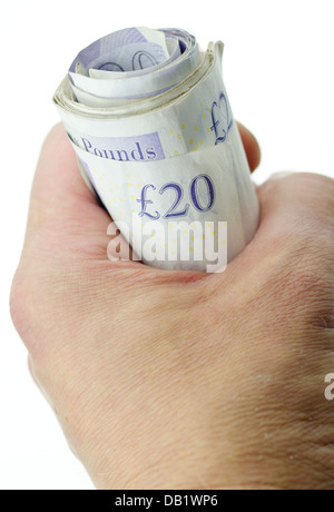 Hand Holding Rolled Up Twenty Pound Notes Stock Photo - Alamy