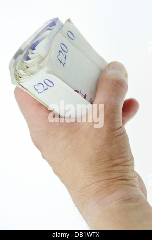 Hand Holding Rolled Up Twenty Pound Notes Stock Photo - Alamy