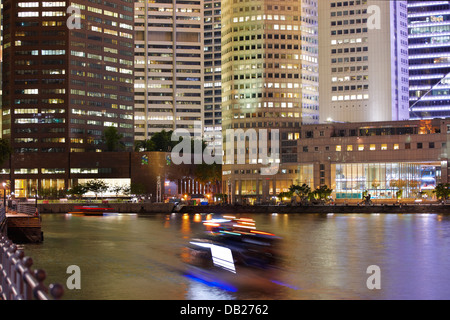 A night view of the Boat Quay on the Singapore River in Singapore. The ...