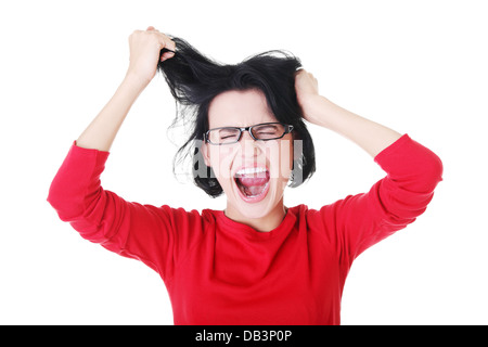 Woman stressed is going crazy pulling her hair Stock Photo - Alamy