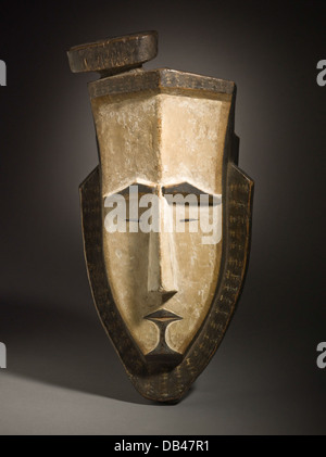This mask is a ritualistic artifact, likely used in ceremonial ...
