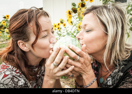 Abigail Sullivan and Kasha Rigby with some vegitables from their garden ...