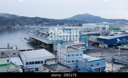 Aerial high angle view of Kesennuma city and its fishing port revealing ...