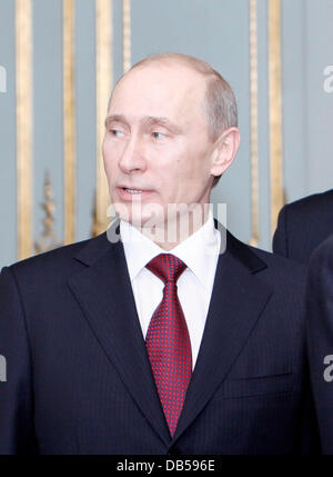 Russian Prime Minister Vladimir Putin signs his autograph on a sea map ...