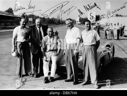 Racing car of the 1950s. The Mercedes team of mechanics pushes a ...