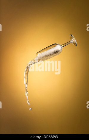 Glass of Wine Falling Mid Air with Spill Stock Photo - Alamy