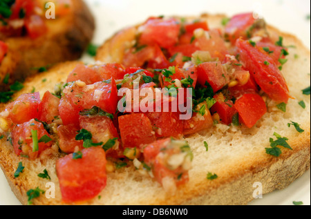 Typical Maltese Hobz Biz-Zejt Toasted bread rubbed with garlic, topped ...