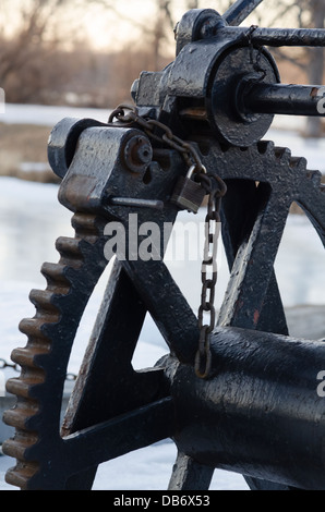 Historical hand powered winch used in the mining industry, stands on ...