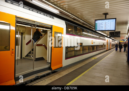 R2 Rodalies de Catalunya train speeding through passeig de gracia ...