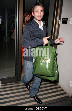 Amy Childs leaves the May Fair hotel in a red clingy dress London ...