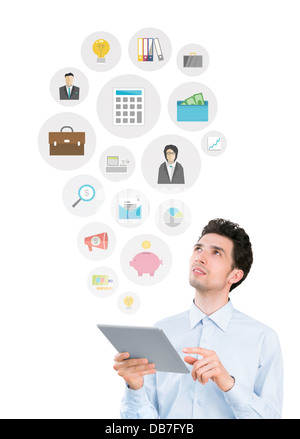 Businessman use apps on digital tablet staring aside feels satisfied ...