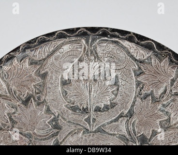 This plate features emblematic pairs of fish, a symbol commonly ...