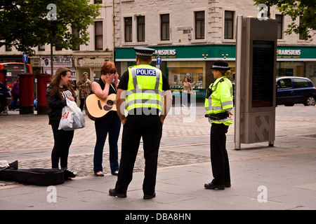 two female police officers chatting Stock Photo - Alamy