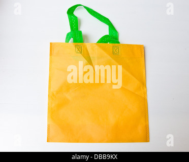 yellow cloth bag on white background Stock Photo - Alamy
