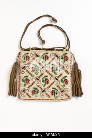 This woman's reticule is a small, decorative bag made from fabric, with ...