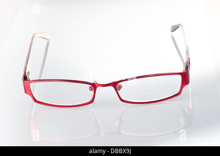 Red spectacles on isolated white background Stock Photo - Alamy