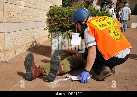 Wounded people being treated by first aid crew Stock Photo - Alamy