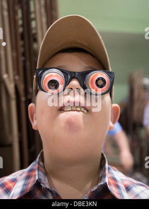 Boy wearing a funny face disguise Stock Photo - Alamy