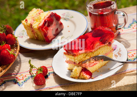 Yellow jaffa cake with strawberries Stock Photo - Alamy