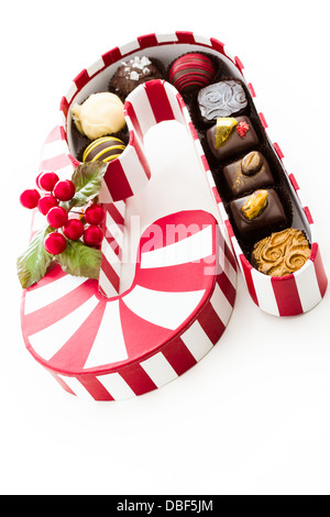 Assorted truffles in candy cane box on a white background Stock Photo ...