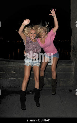 Twins Brittany Taltos (in pink) and her sister Erica Taltos enjoy a ...