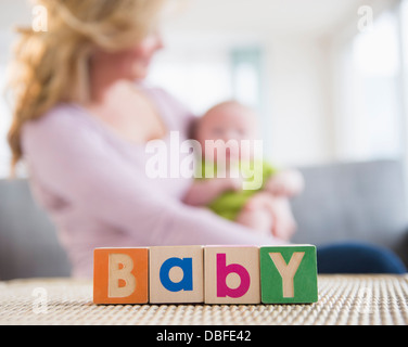 Baby spelling with alphabet blocks Stock Photo - Alamy