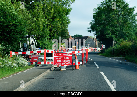 Temporary traffic lights at roadworks on a road in the UK Stock Photo ...