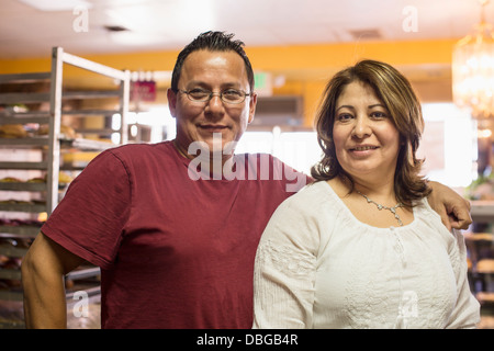 Hispanic bakers smiling in kitchen Stock Photo - Alamy