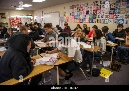 A California high school students work together during a reading ...