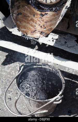 Hot Tar Kettle Machine and Bucket Stock Photo - Alamy