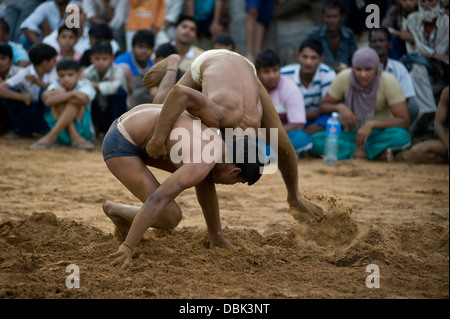 Indian Kushti wrestlers compete during a traditional Dangal ...