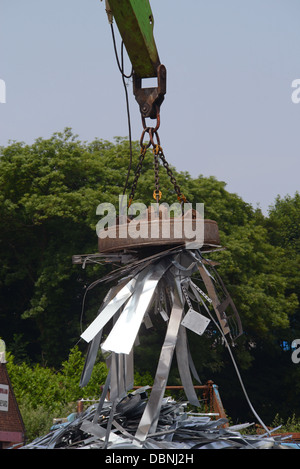 Electromagnetic crane lifting scrap steel for recycling at the Pacific ...