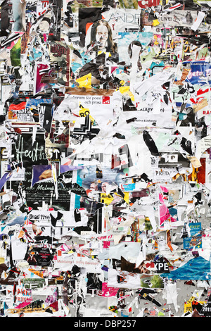 Torn billboard posters Stock Photo - Alamy