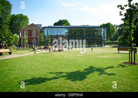 View of Enfield Town public library with children playing in the ...