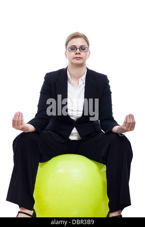 Young businesswoman meditating on the white Stock Photo - Alamy