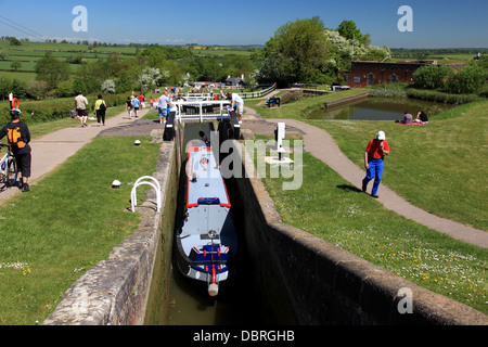 A narrowboat ascending Foxton Locks, on the Grand Union Canal, with the ...