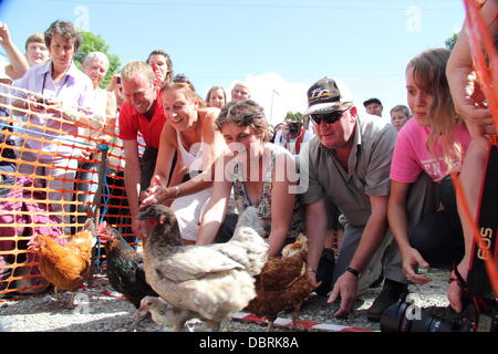 Competitors & their fowl at The Hen Racing World Championships outside ...