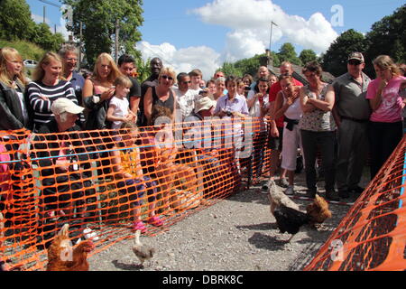 Competitors & their fowl at The Hen Racing World Championships outside ...