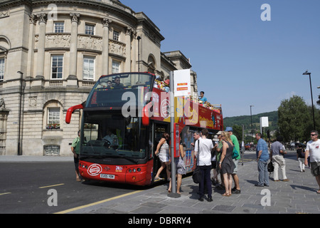 Bus stop passengers queuing to board bus in St Peters Square, Hereford ...