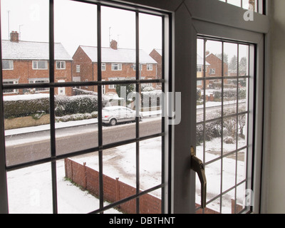 Looking through a snowy window at a cold snowy scene outdoors Stock ...