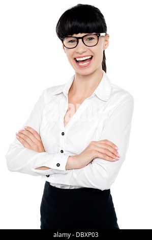 Bespectacled happy woman posing casually with arms folded Stock Photo ...