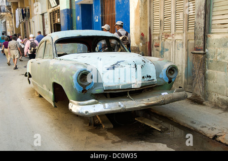 Old car on blocks with no wheels wrecked and abandoned vehicle Stock ...