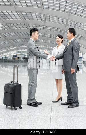 Business People Travel Handshake Airport Concept Stock Photo - Alamy