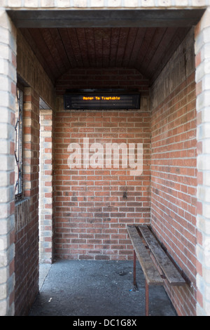 Bus stop sign and timetable Stock Photo - Alamy