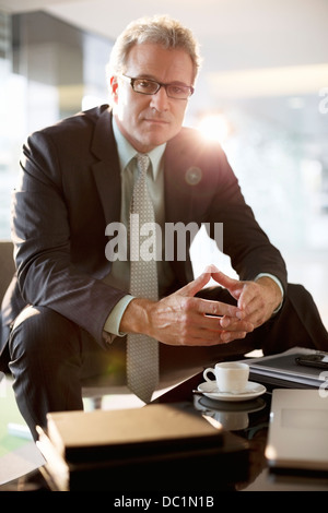 Full length portrait of confident businessman standing with coworkers ...