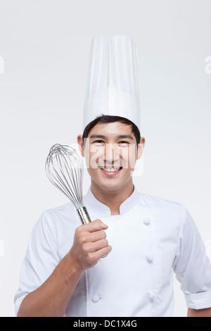 a male cook posing with cooking tool Stock Photo - Alamy